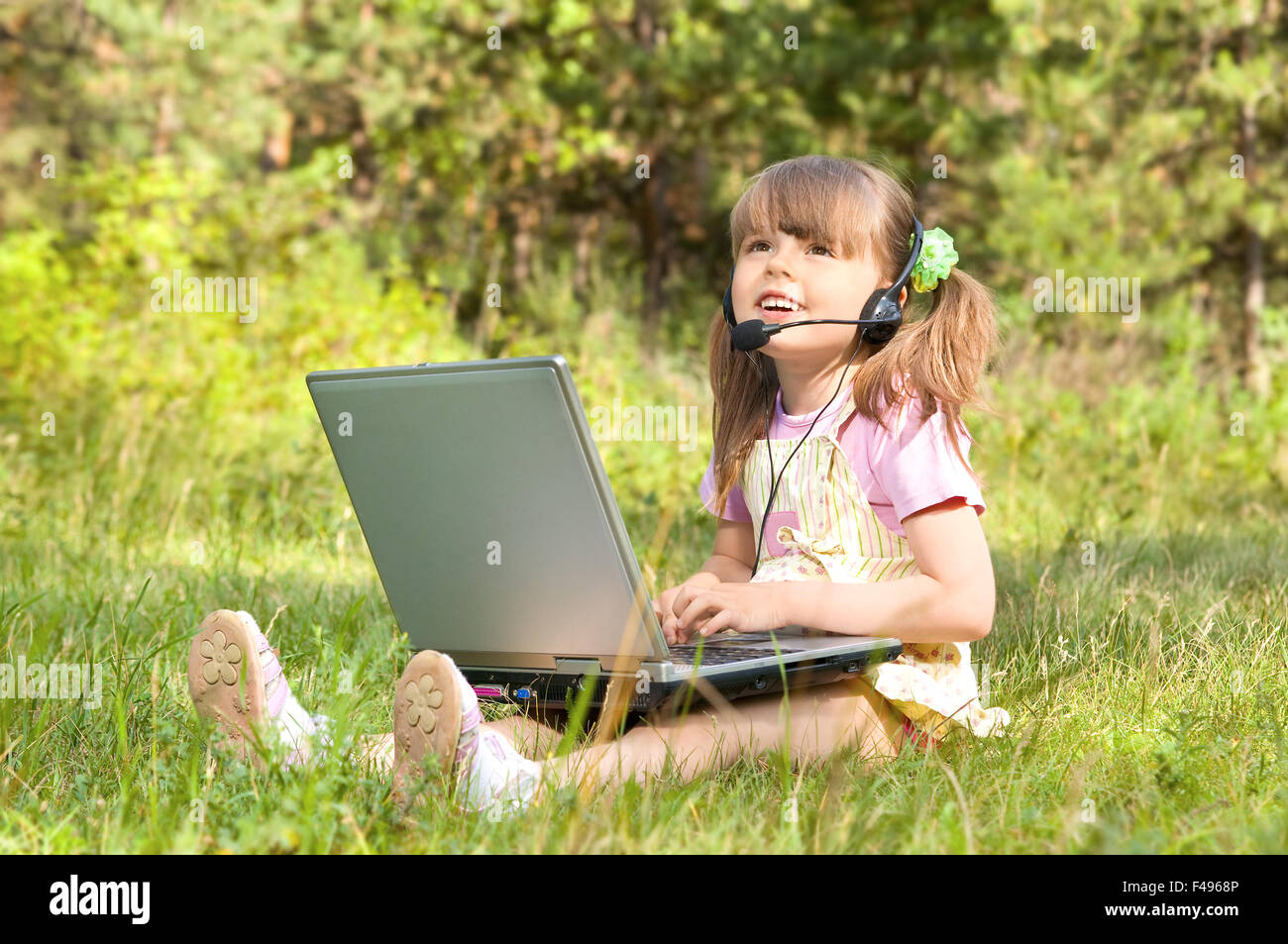 little girl with computer Stock Photo - Alamy