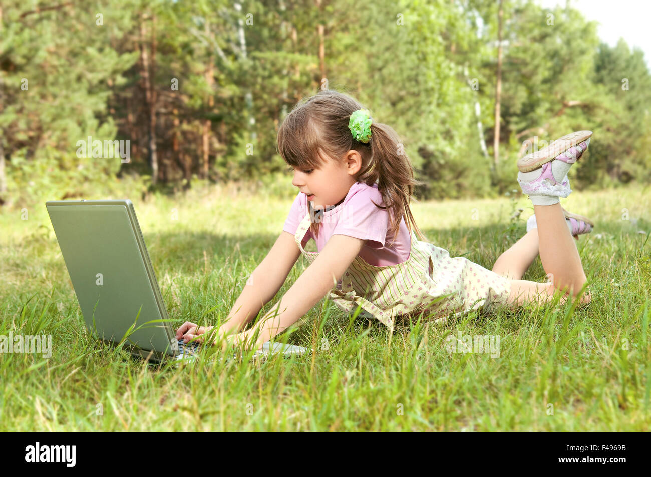 little girl with computer Stock Photo - Alamy
