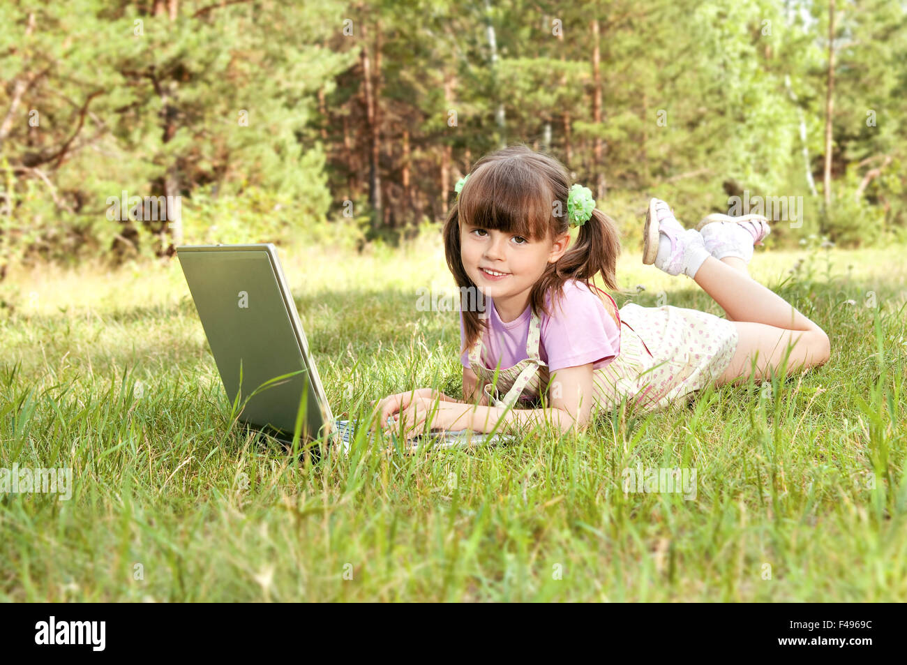 little girl with computer Stock Photo - Alamy