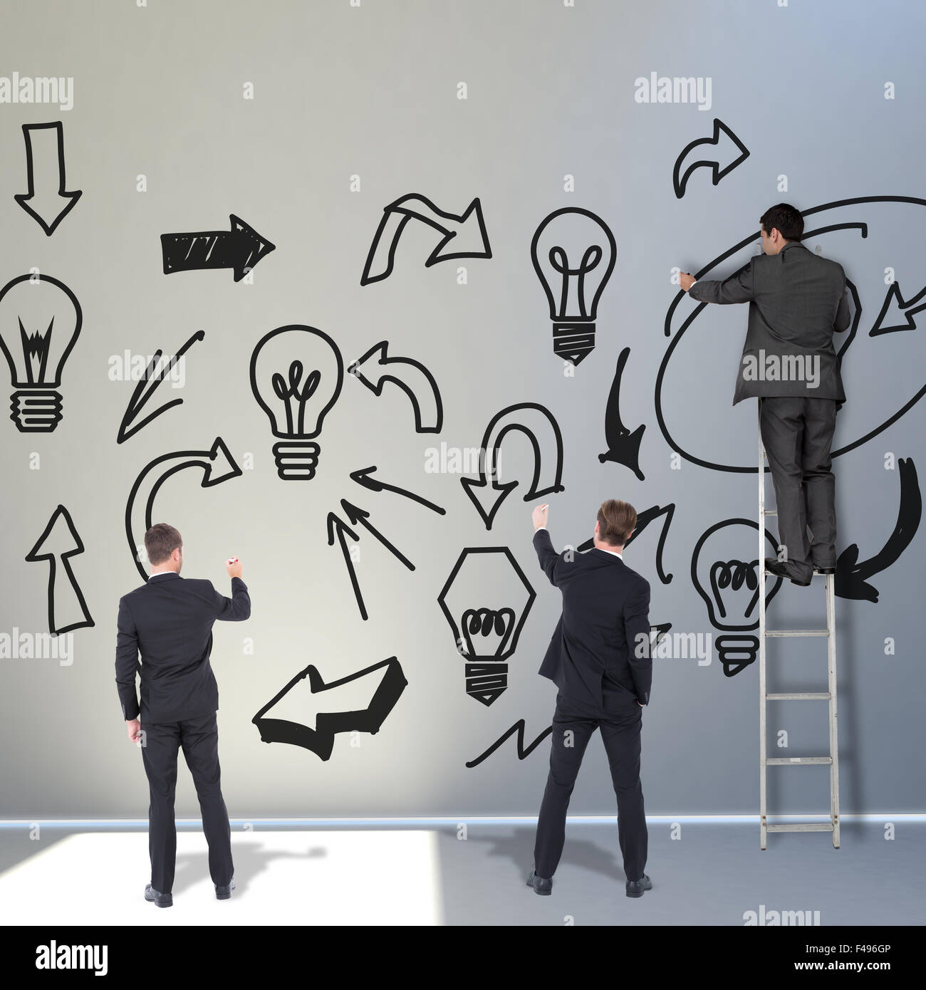 Composite image of business team writing Stock Photo - Alamy