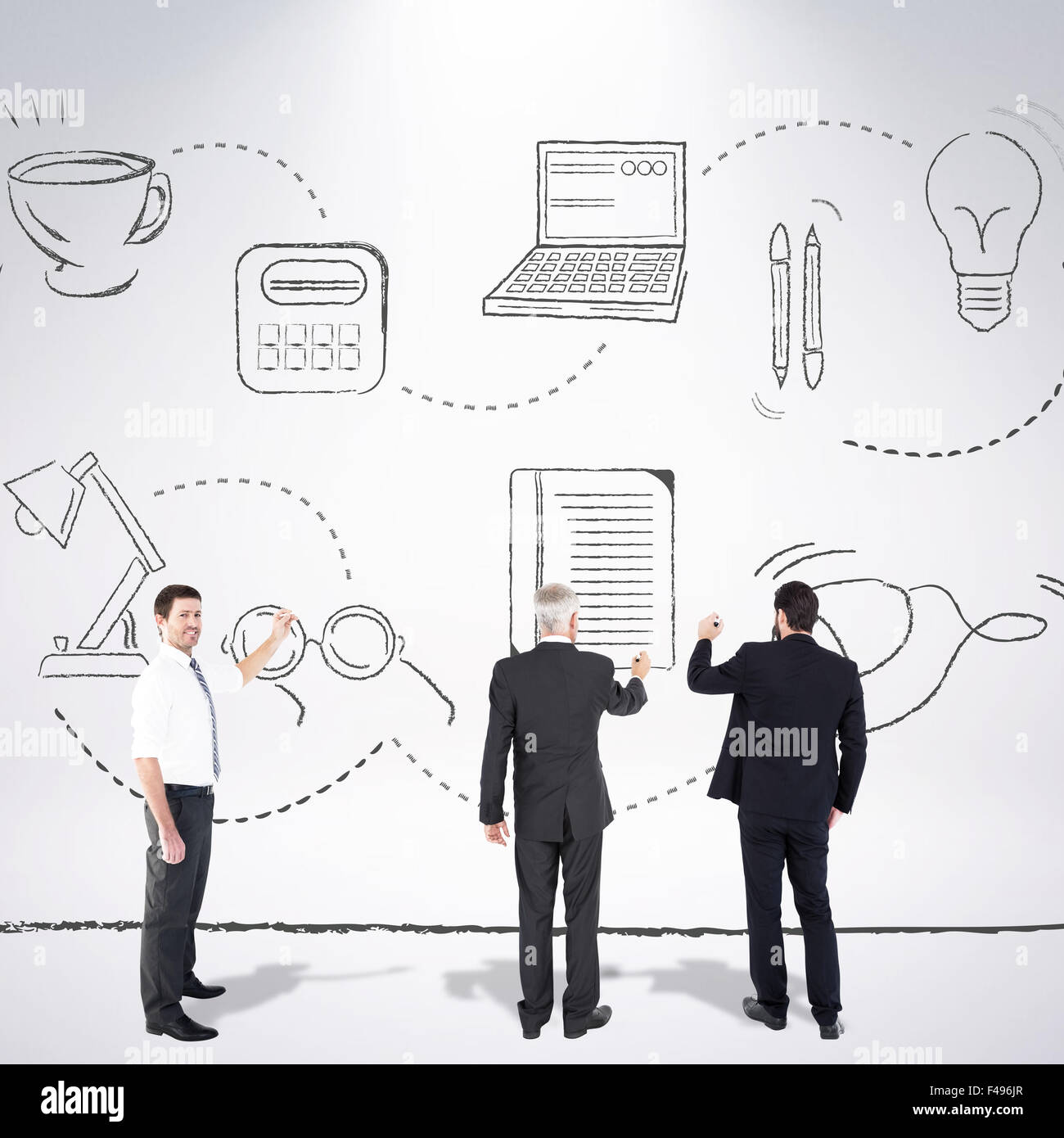 Composite image of business team writing Stock Photo - Alamy