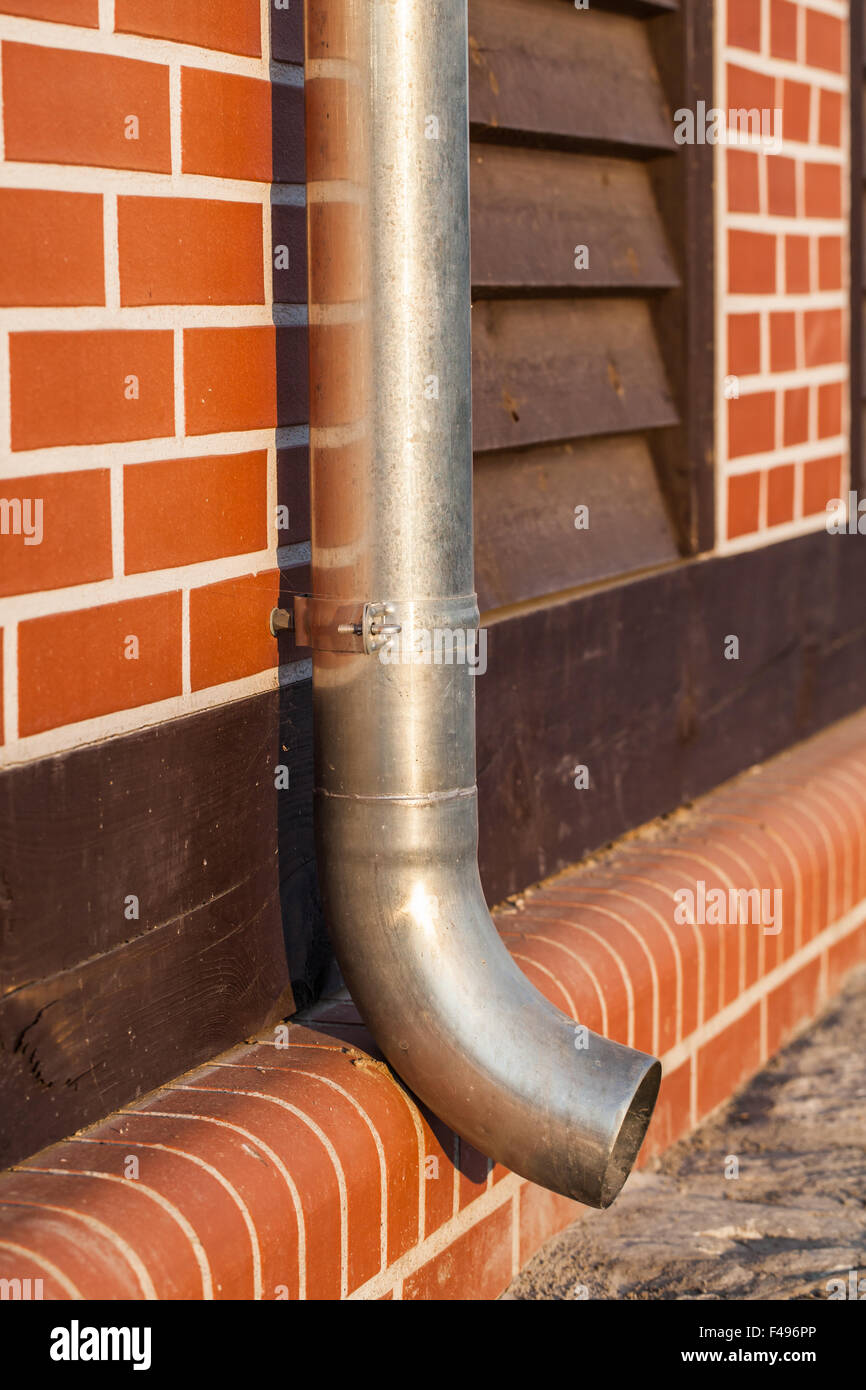 gutter pipe and brick wall Stock Photo - Alamy