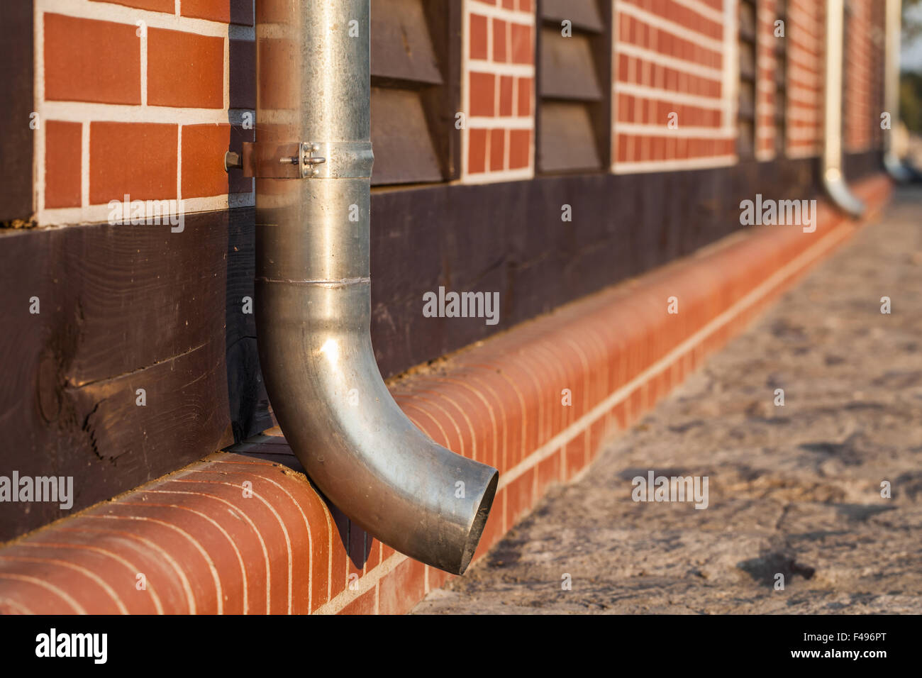 gutter pipe and brick wall Stock Photo - Alamy