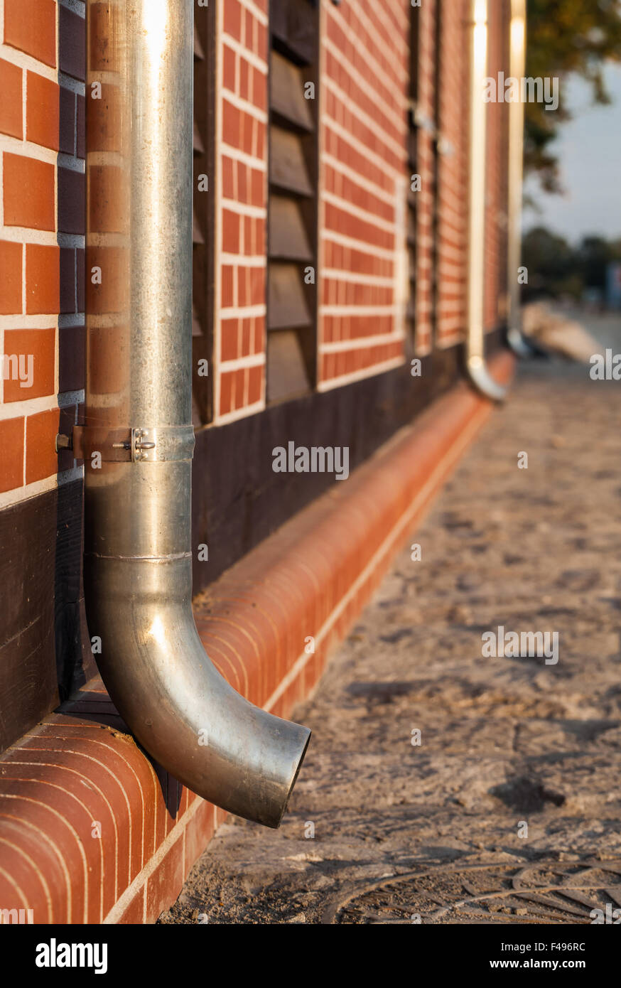 gutter pipe and brick wall Stock Photo - Alamy