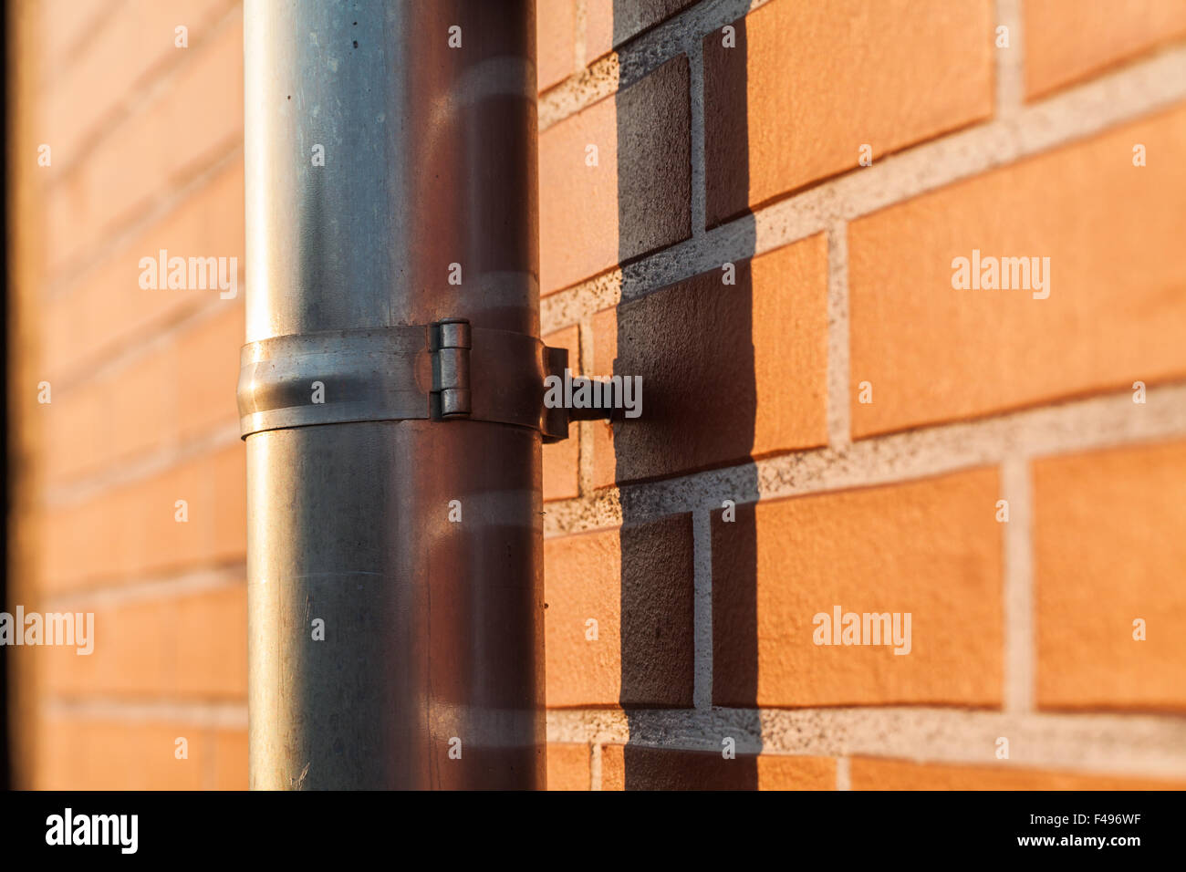gutter pipe and brick wall Stock Photo - Alamy