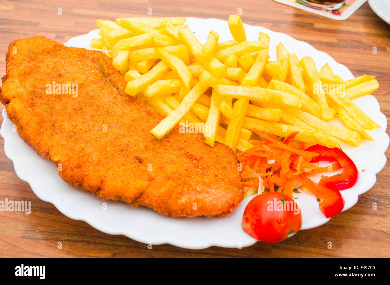 Wiener Schnitzel, French fries Stock Photo - Alamy
