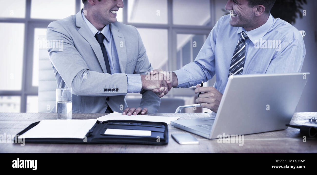 Business partners shaking hands workplace hi-res stock photography and ...