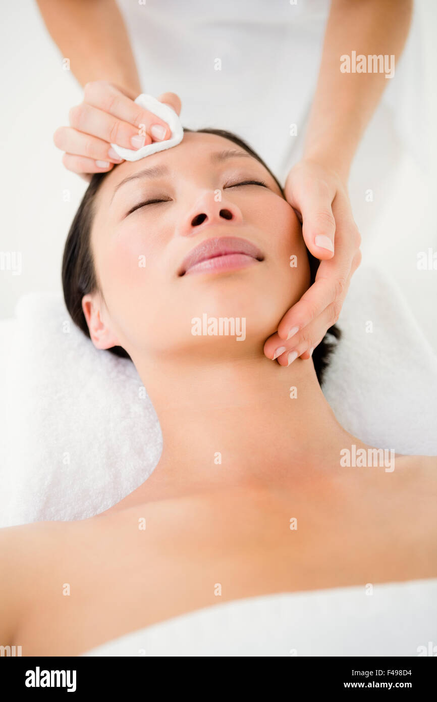 Hands cleaning woman face with cotton swabs Stock Photo - Alamy