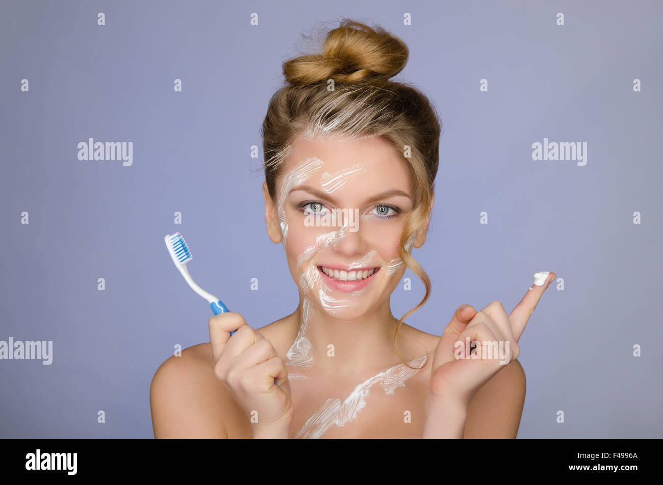 happy woman with toothbrush and toothpaste Stock Photo - Alamy