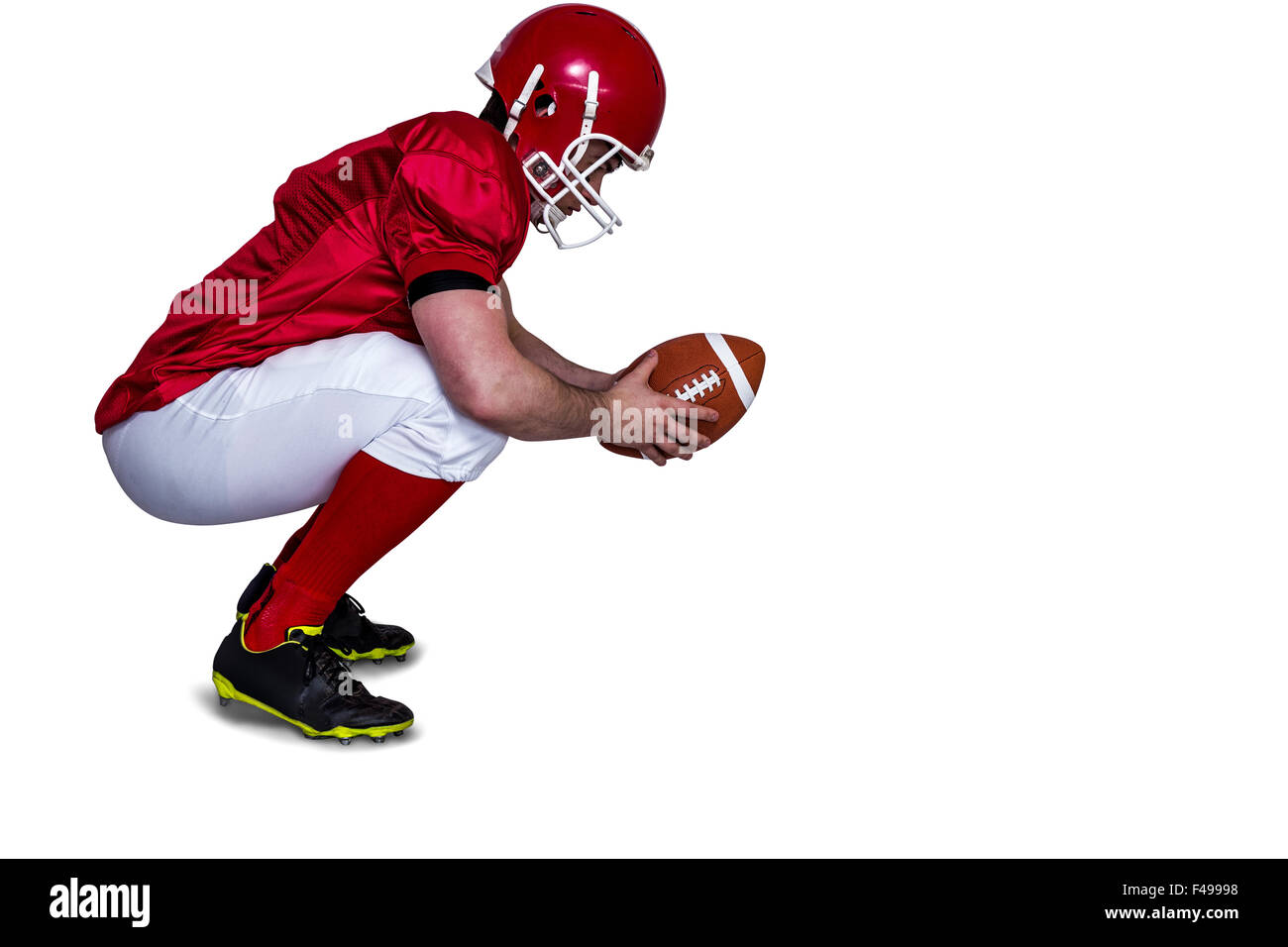 American football player in attack stance Stock Photo - Alamy