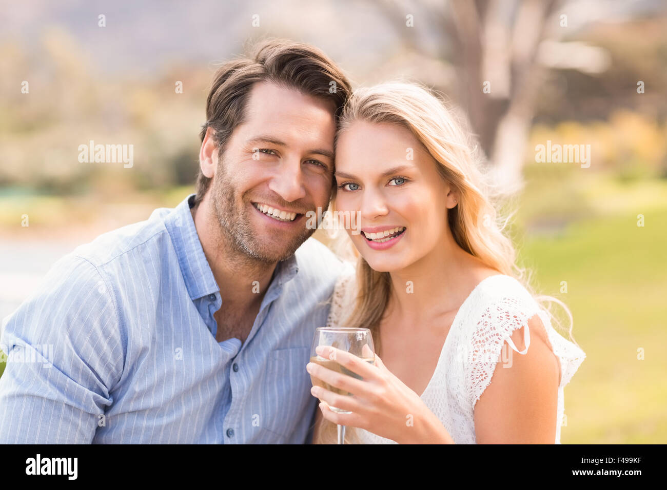 Cute couple on date looking at the camera Stock Photo - Alamy