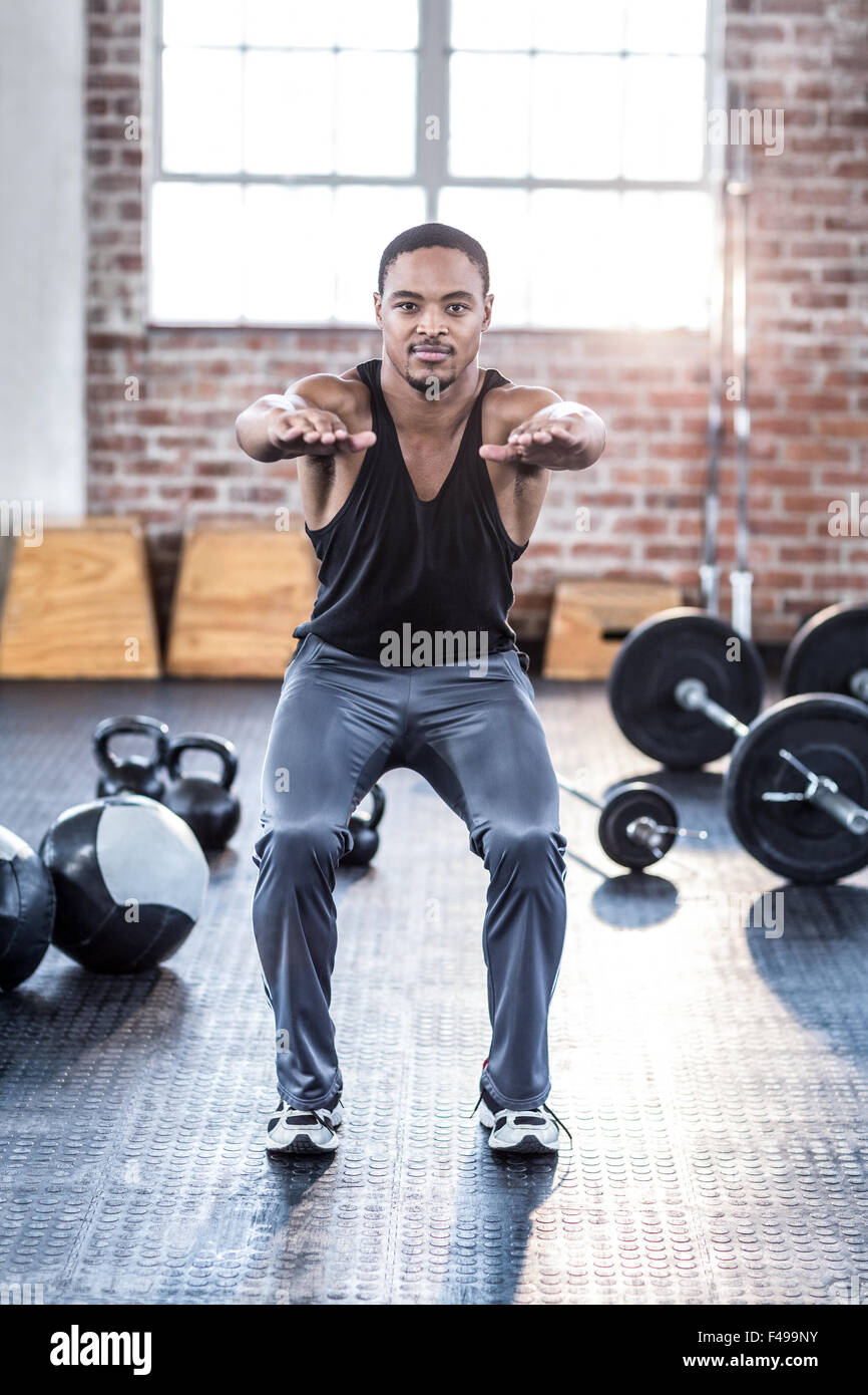 Muscular man doing stretching exercises Stock Photo - Alamy