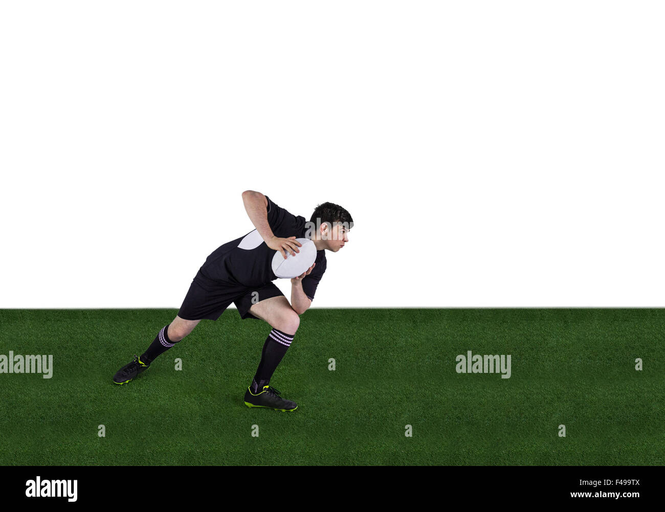 Rugby player running with the rugby ball Stock Photo - Alamy