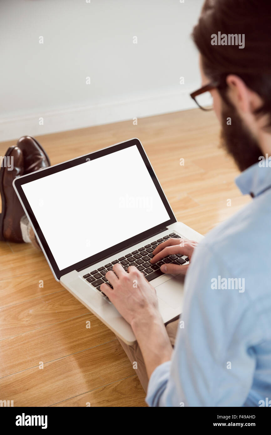Handsome hipster using his laptop Stock Photo - Alamy