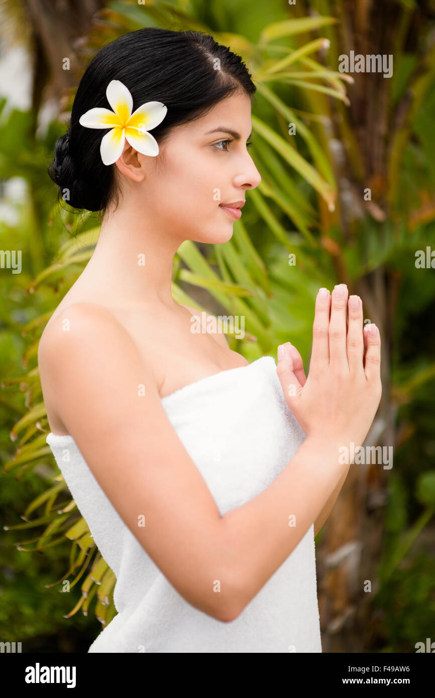 Pretty woman praying before her spa day Stock Photo - Alamy
