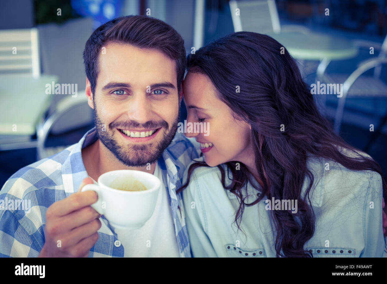 Cute couple having coffee together Stock Photo - Alamy