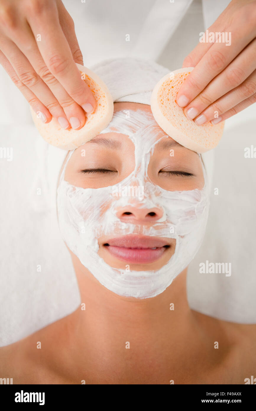 Hand cleaning womans face with cotton swabs Stock Photo - Alamy