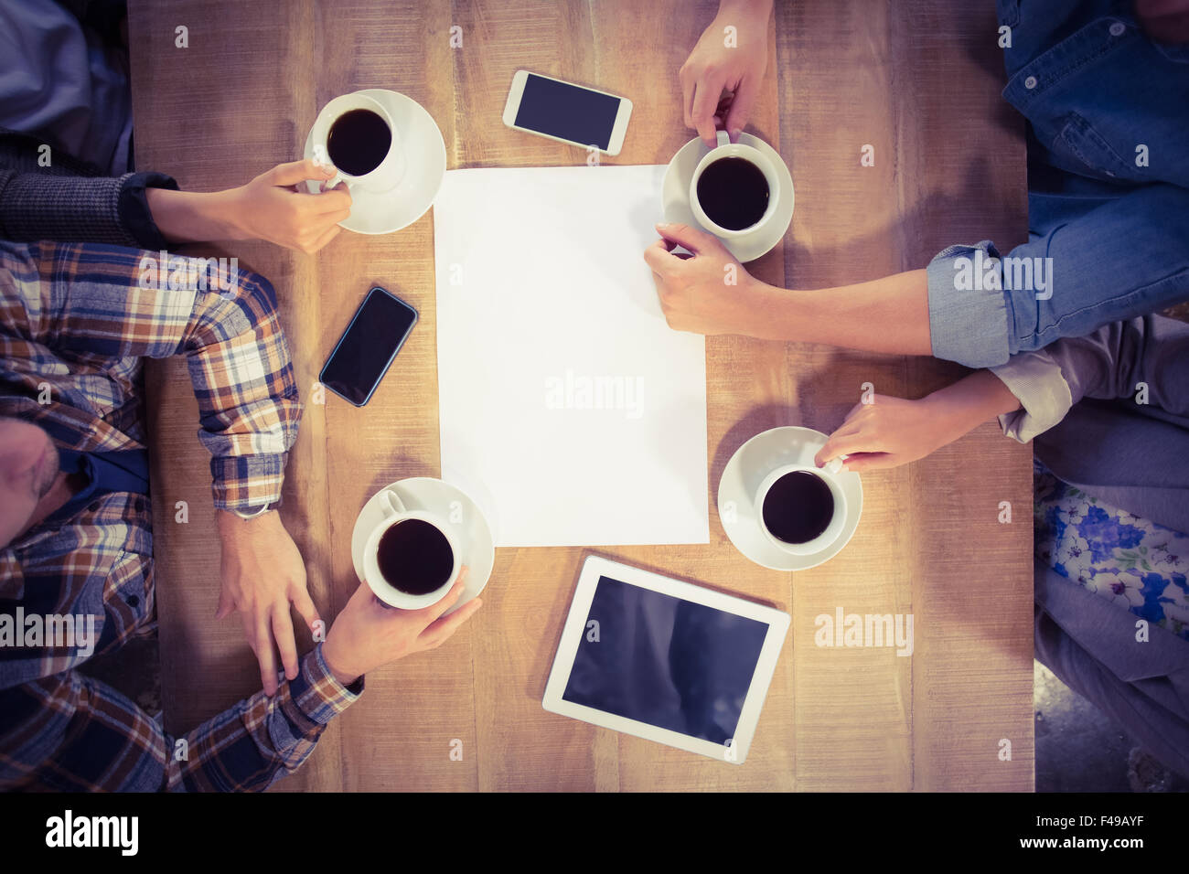 Friends sitting and drinking coffee Stock Photo - Alamy