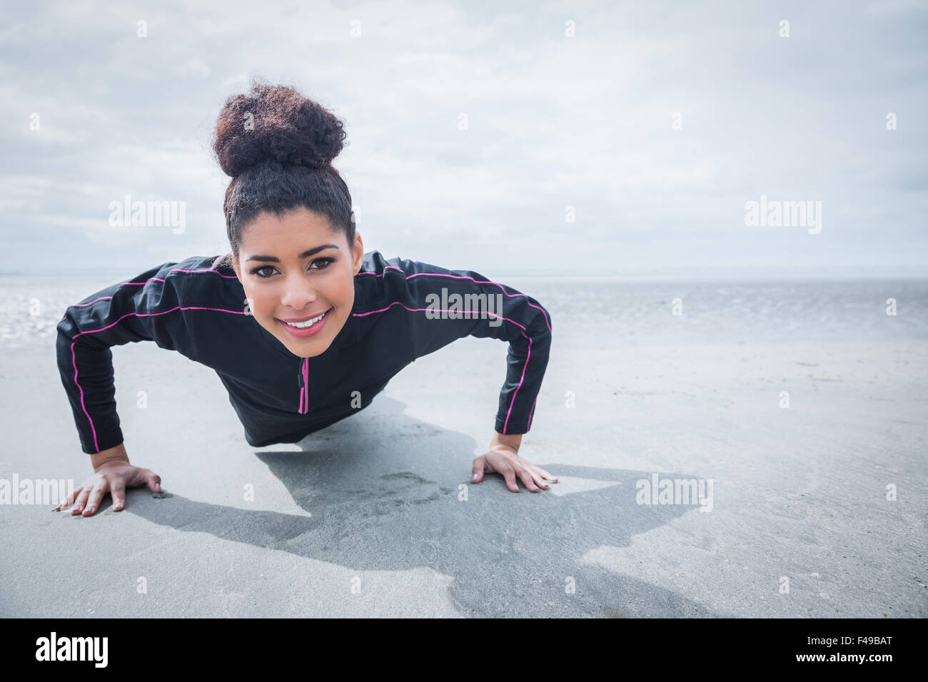 Fit girl working out on cold day Stock Photo - Alamy
