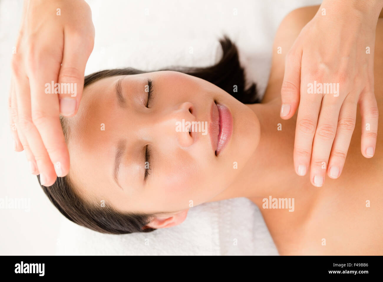 Woman receiving alternative therapy Stock Photo - Alamy