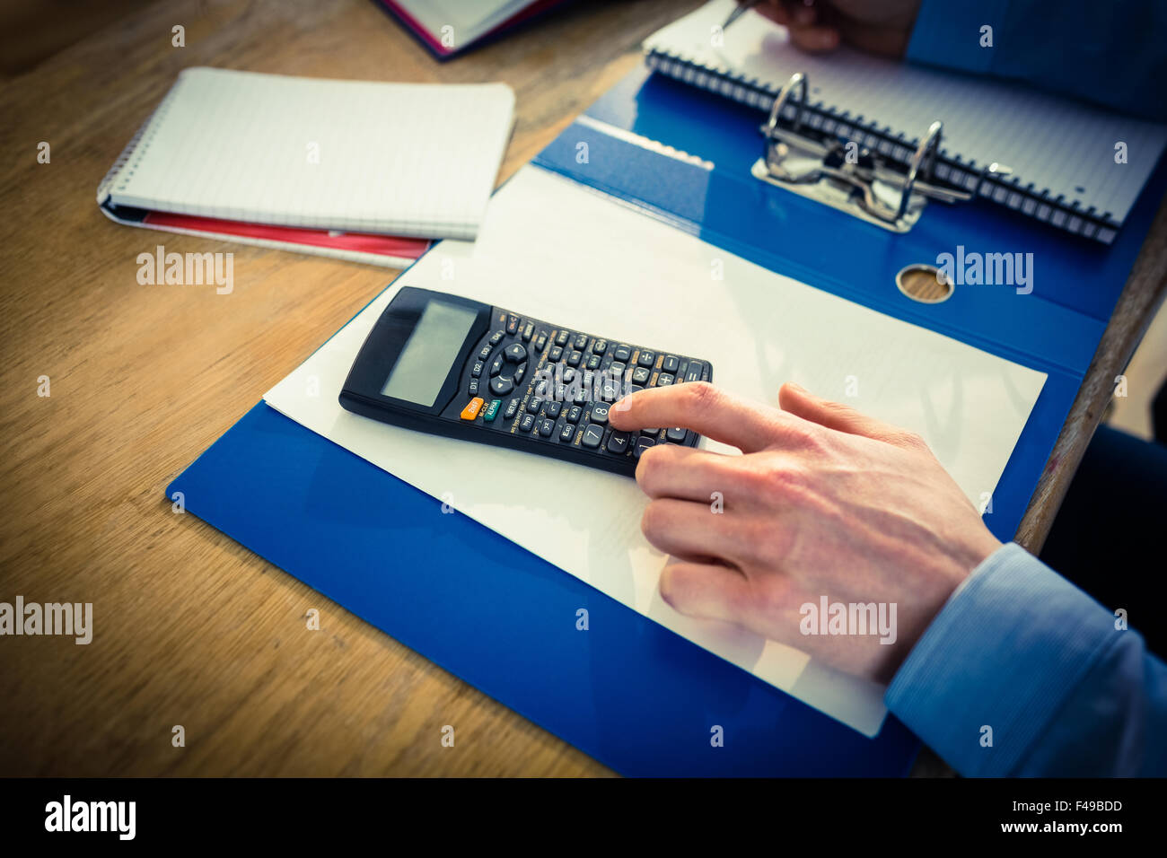 Elegant young businessman calculator hi-res stock photography and ...