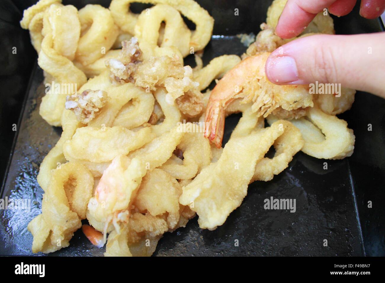 mixture of fried fish with rings of squid and shrimp Stock Photo - Alamy