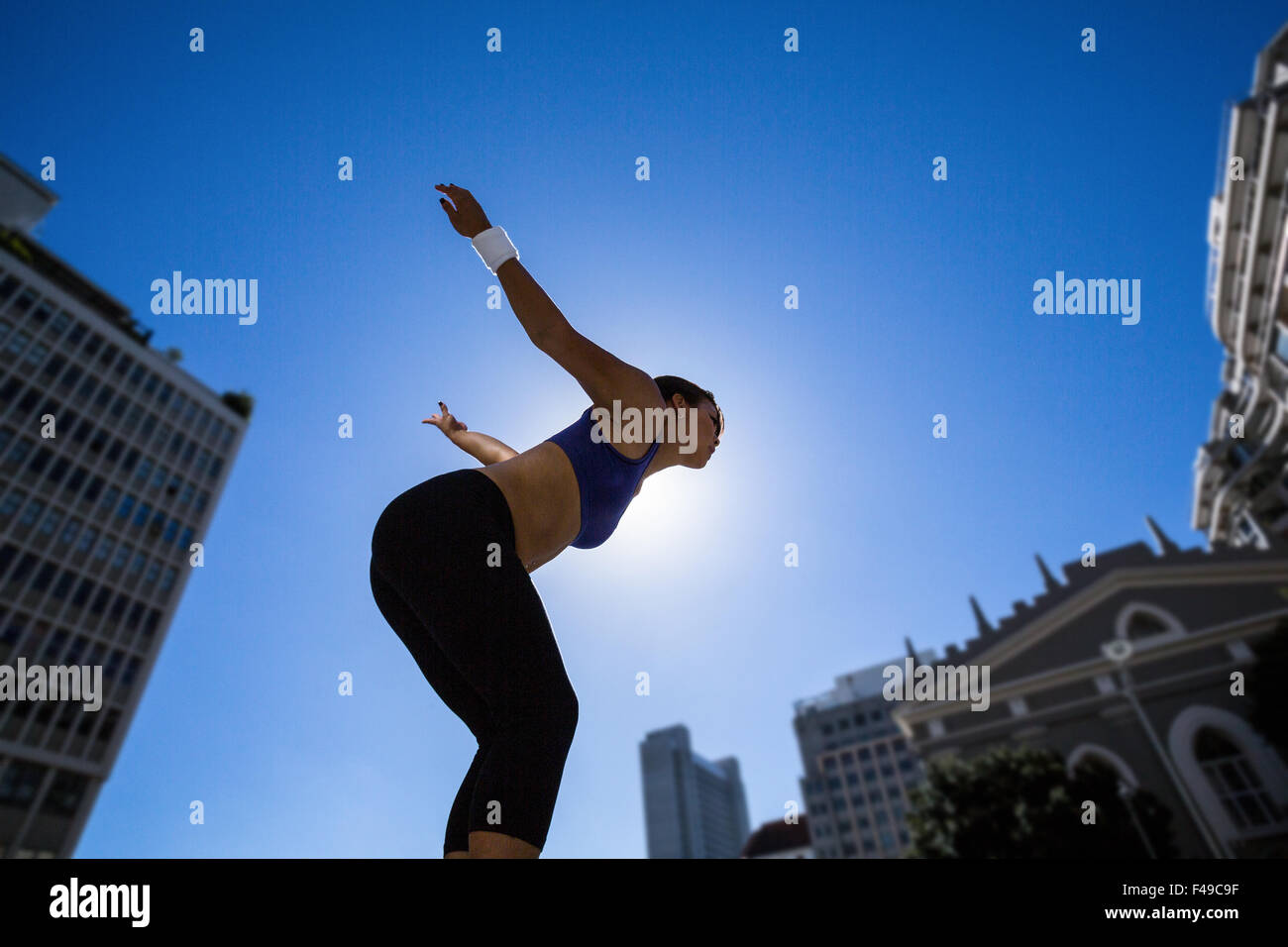 Athletic woman preparing for jump Stock Photo - Alamy