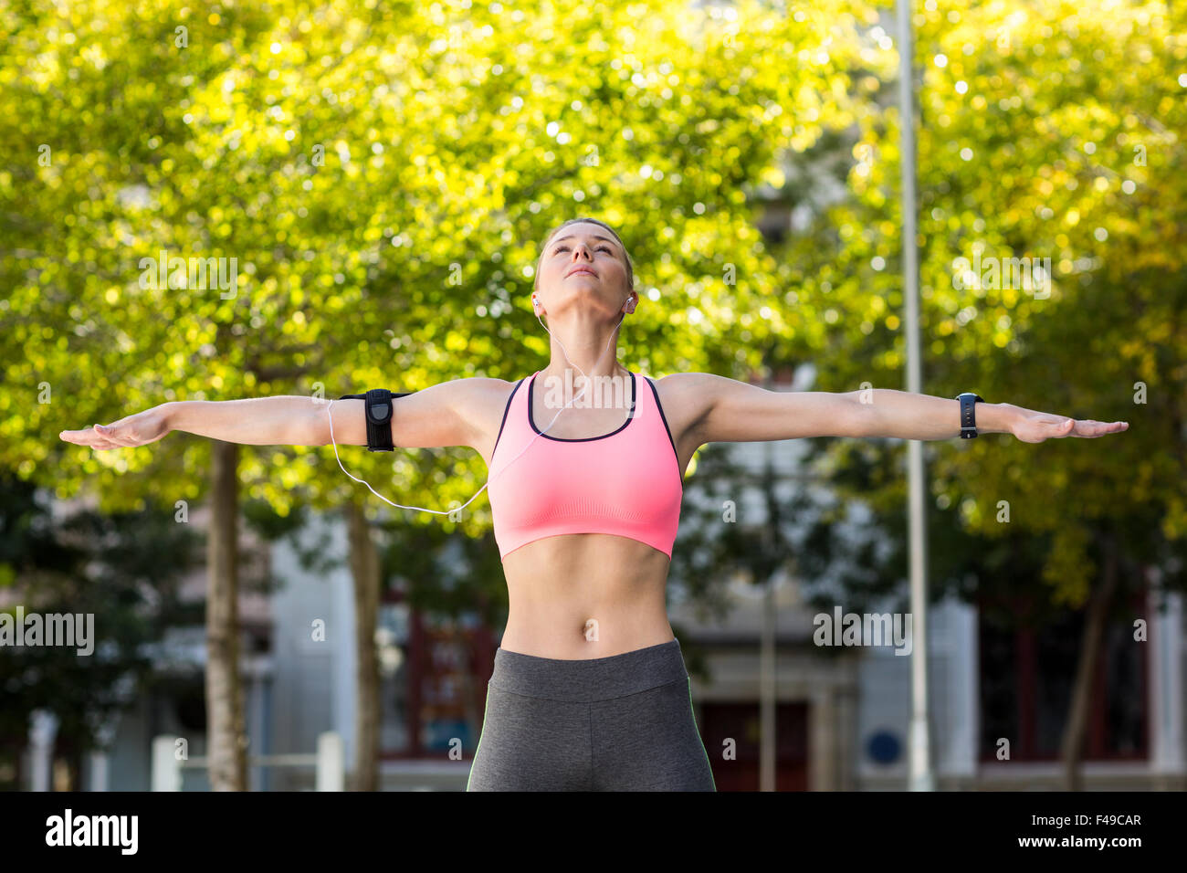 A beautiful athlete stretching her arms Stock Photo - Alamy