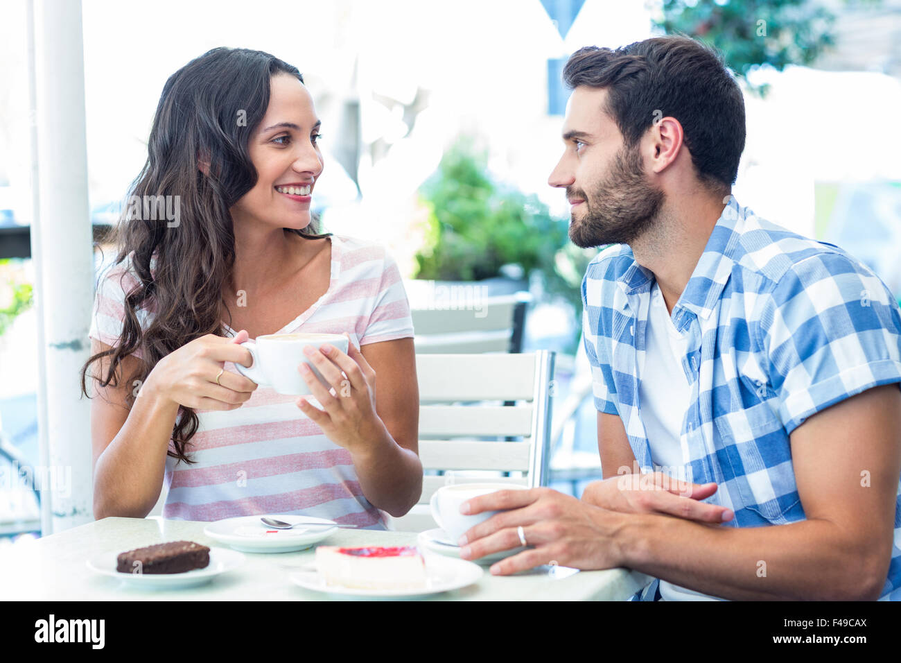 Young happy couple smiling at each other Stock Photo - Alamy