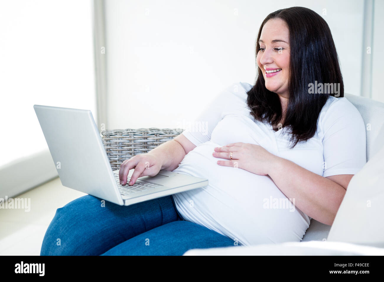 Beautiful pregnant woman laptop sitting hi-res stock photography and ...