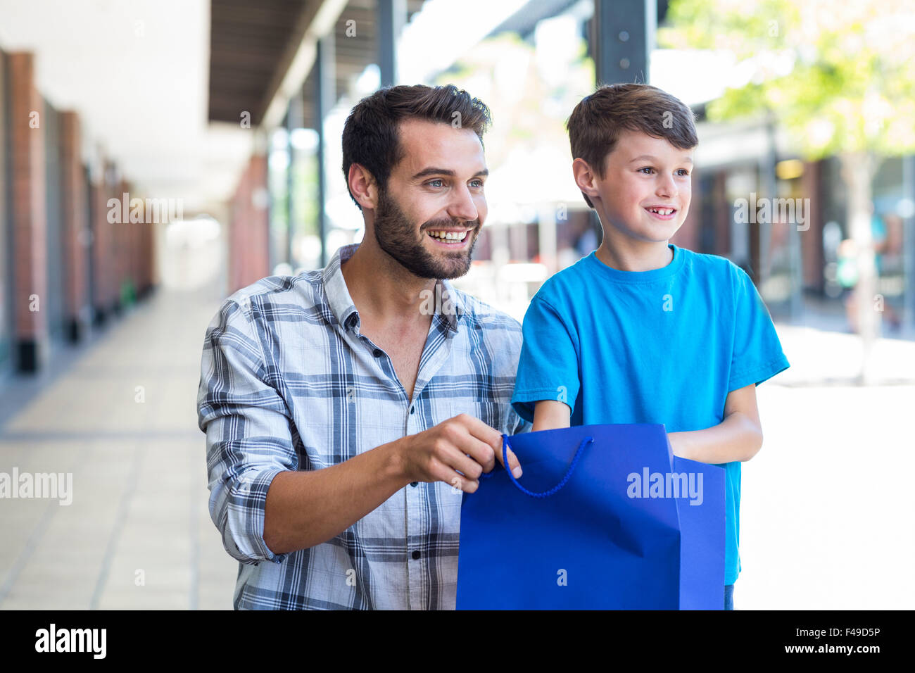 A father and his son looking away Stock Photo - Alamy