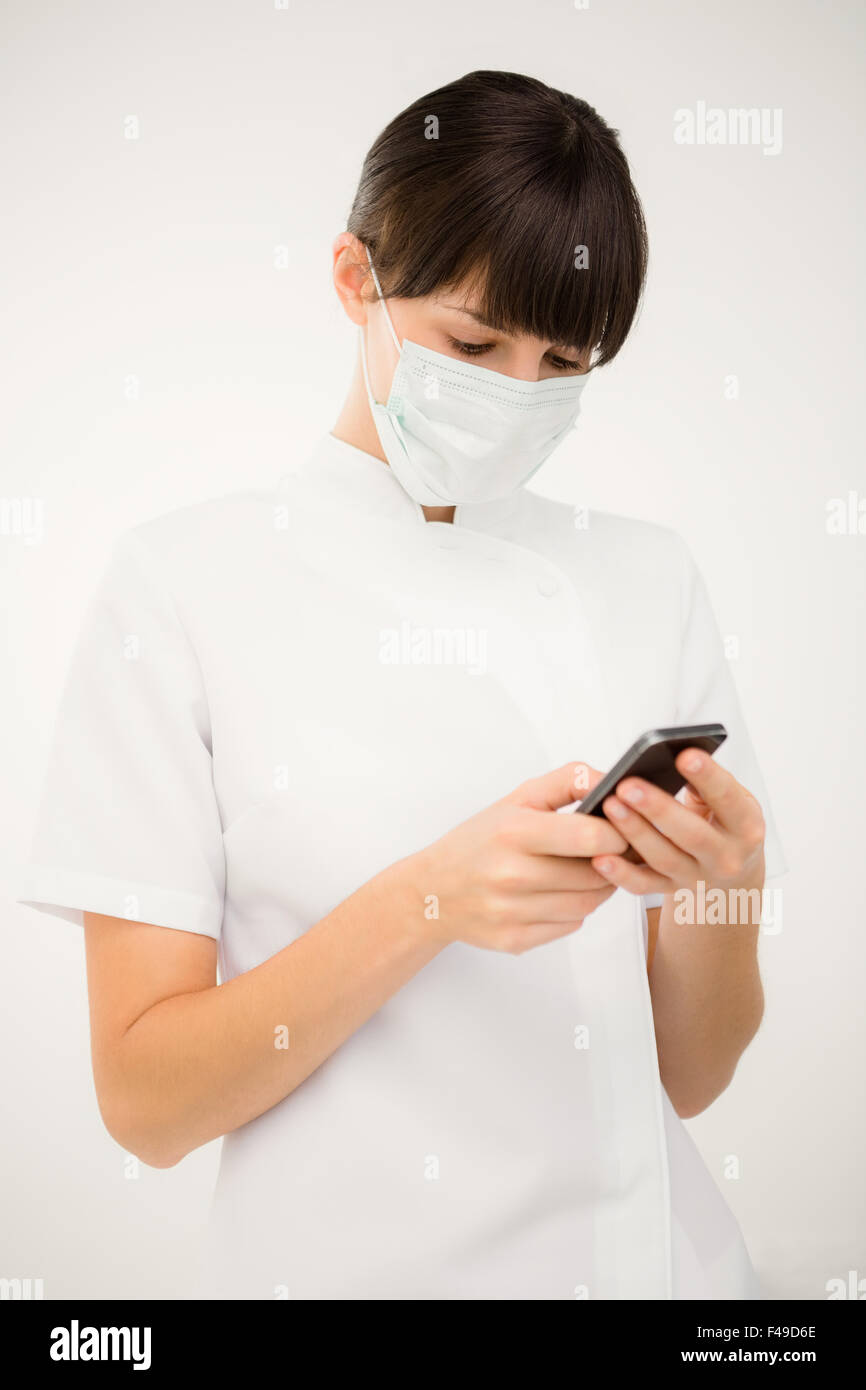Portrait of a nurse using her mobile phone Stock Photo - Alamy