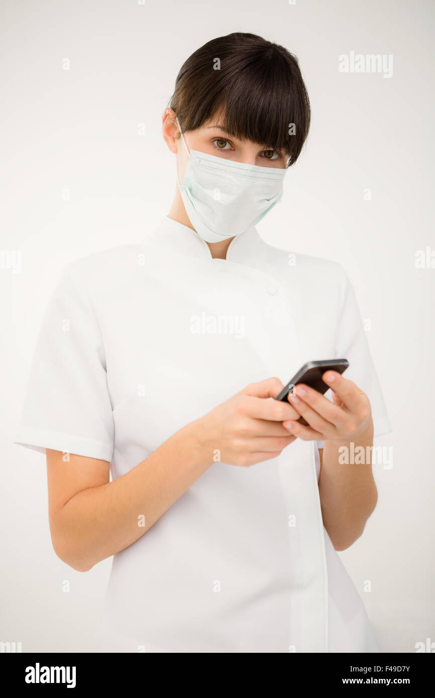 Portrait of a nurse using her mobile phone Stock Photo - Alamy