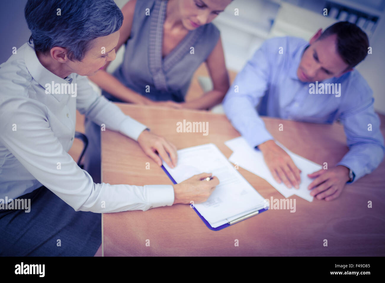 A business team brainstorming together Stock Photo - Alamy