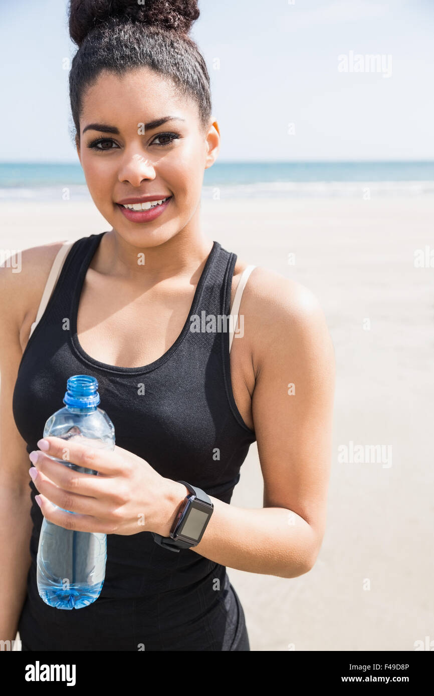 Fit woman wearing smart watch Stock Photo - Alamy