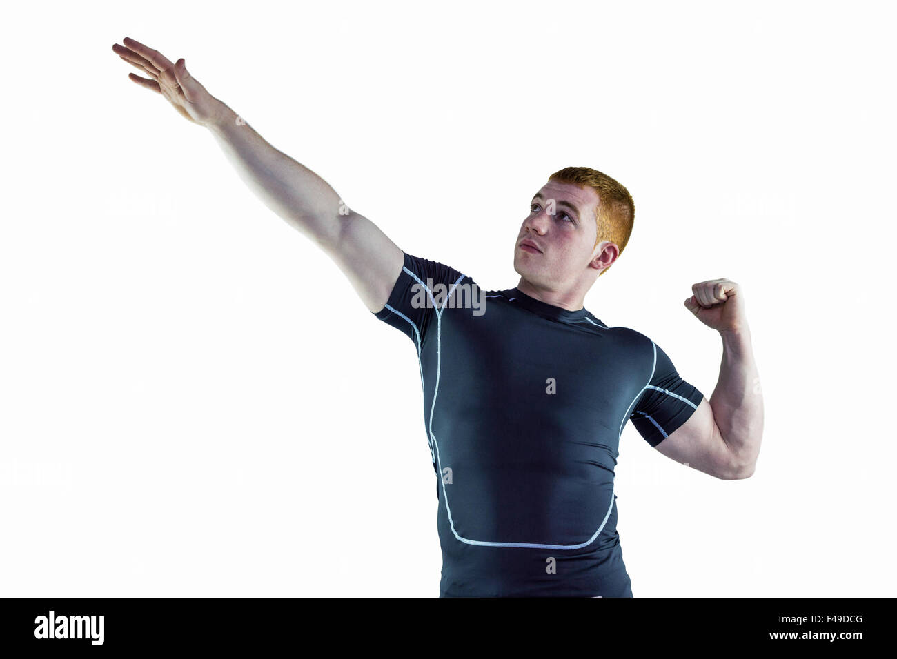 Muscular rugby player pointing to the sky Stock Photo - Alamy