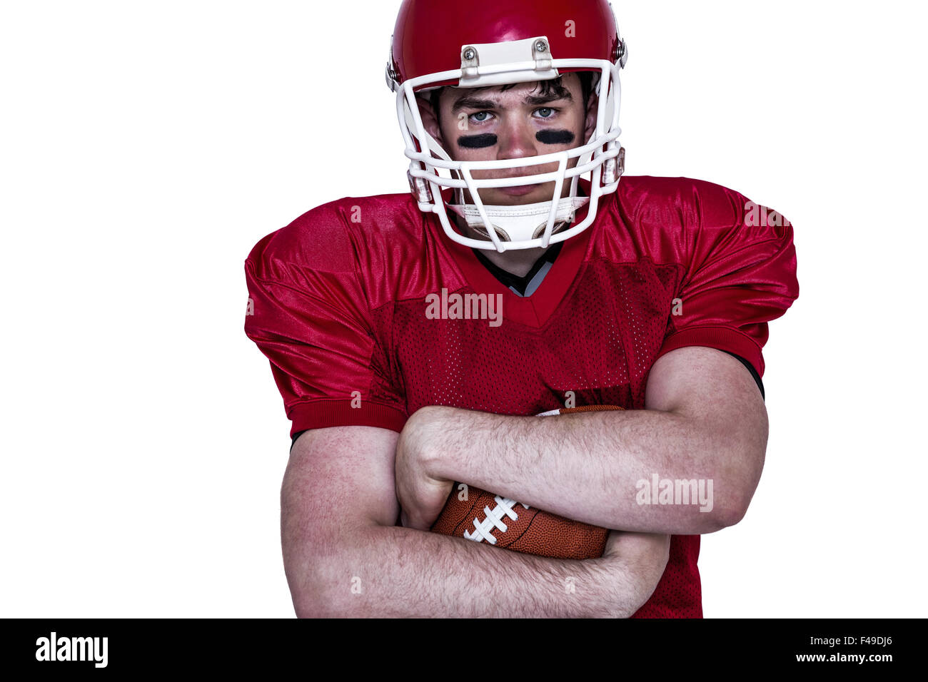 American football player with arms crossed Stock Photo - Alamy