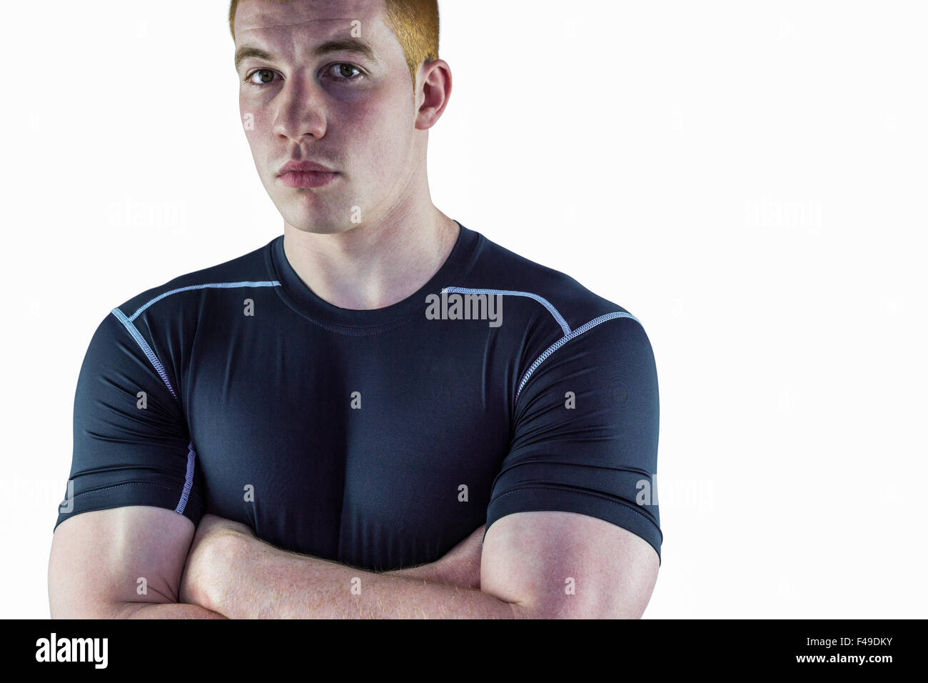 Muscular rugby player with arms crossed Stock Photo - Alamy