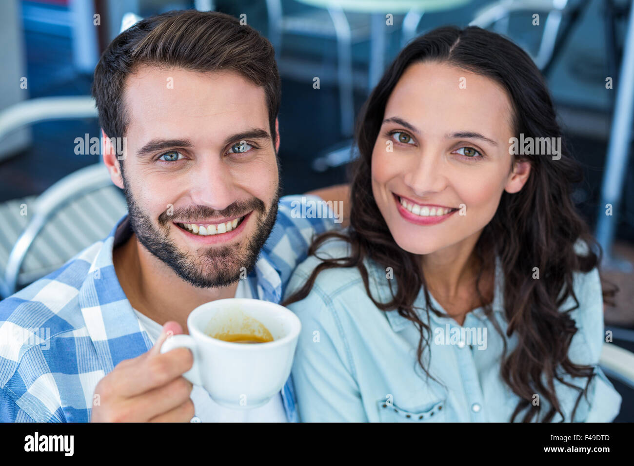 Cute couple having coffee together Stock Photo - Alamy
