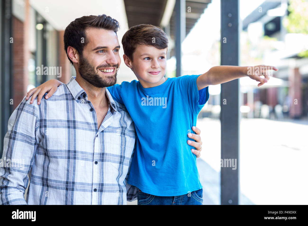 Son and father look away Stock Photo - Alamy