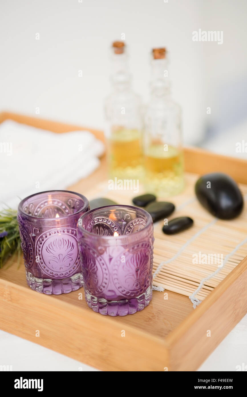 Massage tray with candles and stones Stock Photo - Alamy