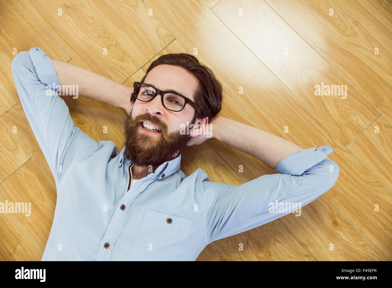 Handsome hipster lying and smiling Stock Photo - Alamy