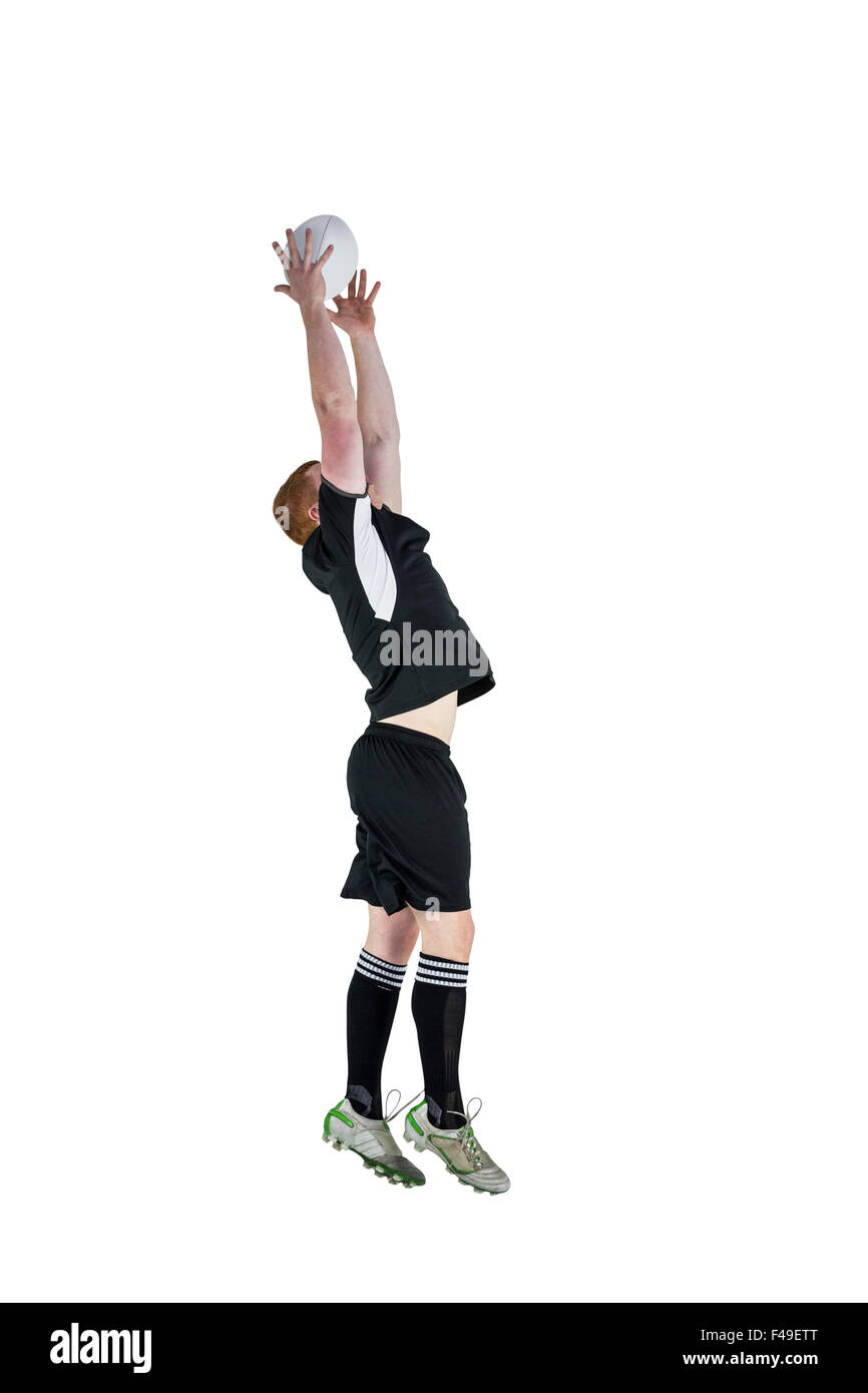 Rugby player catching a rugby ball Stock Photo - Alamy