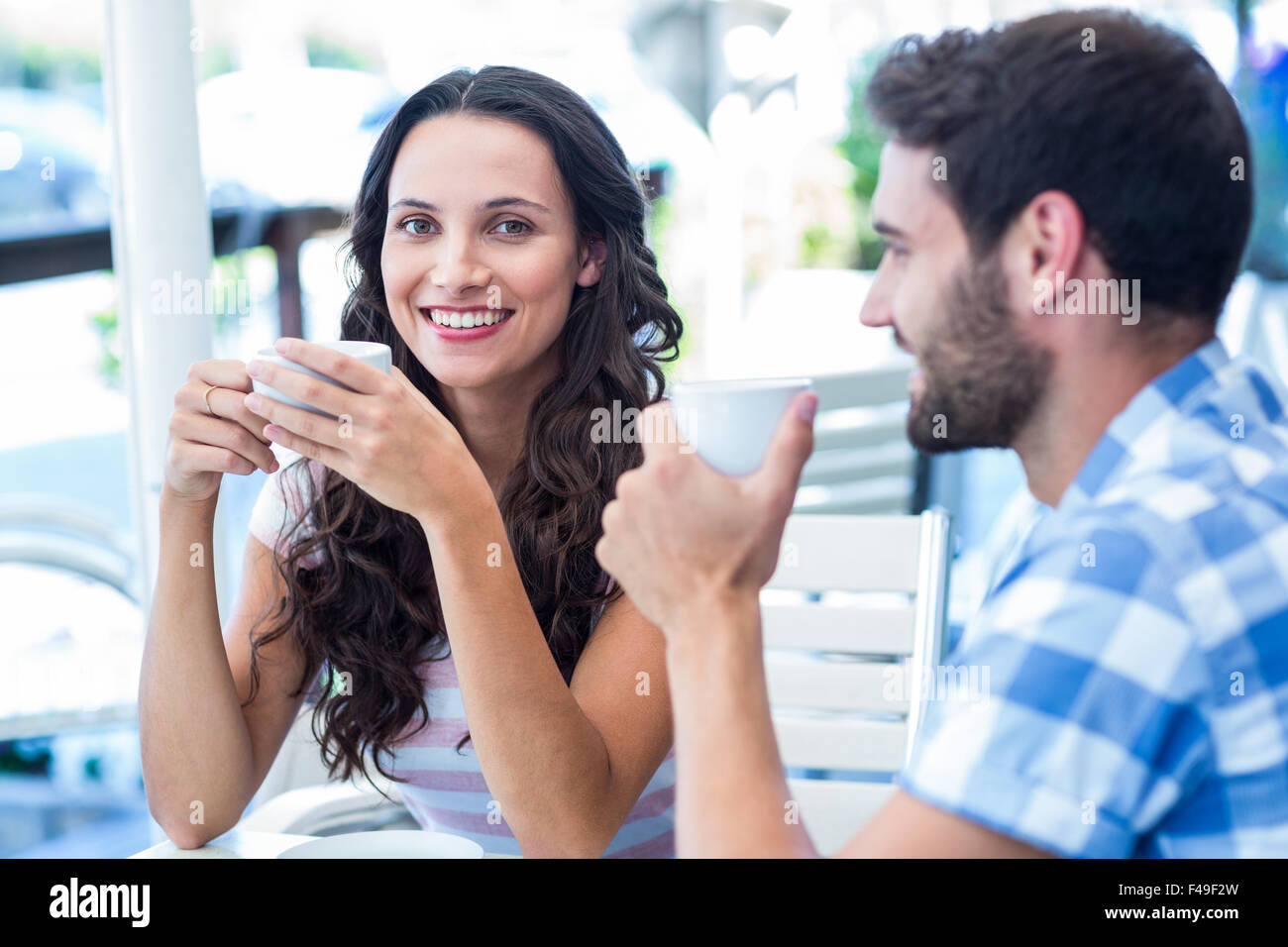 Cute couple having coffee together Stock Photo - Alamy