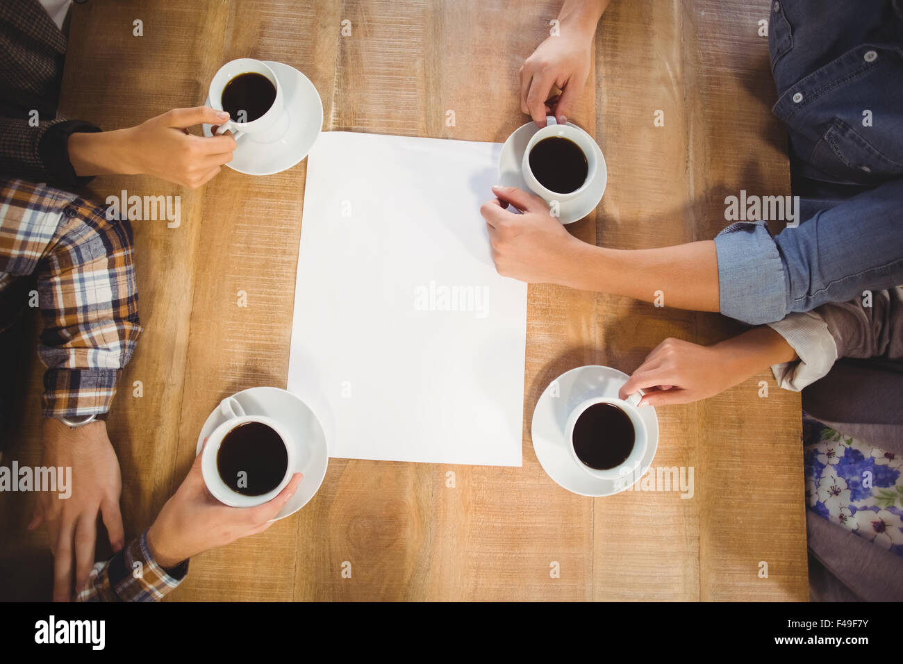 Friends sitting and drinking coffee Stock Photo - Alamy
