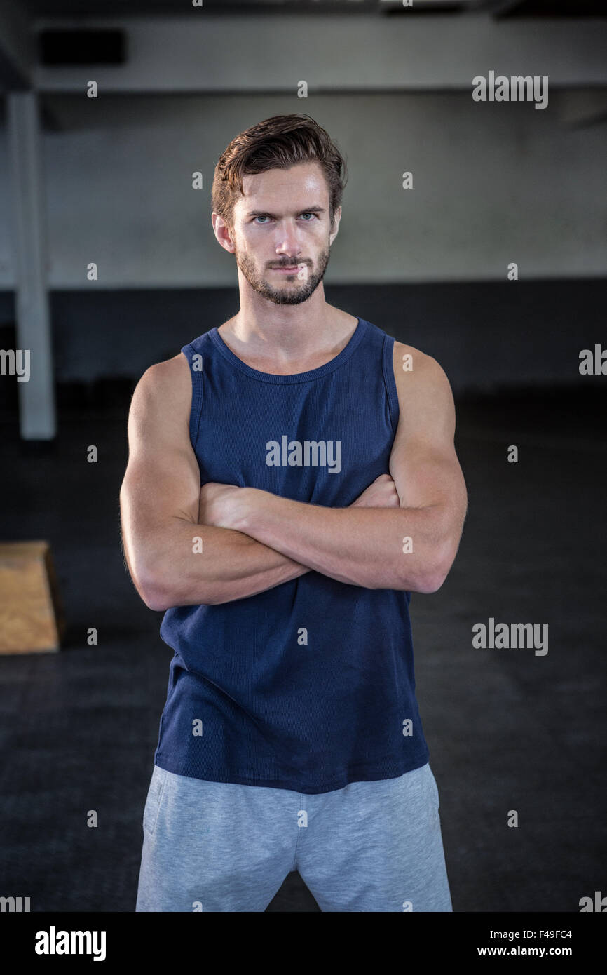 Fit man with arms crossed Stock Photo - Alamy
