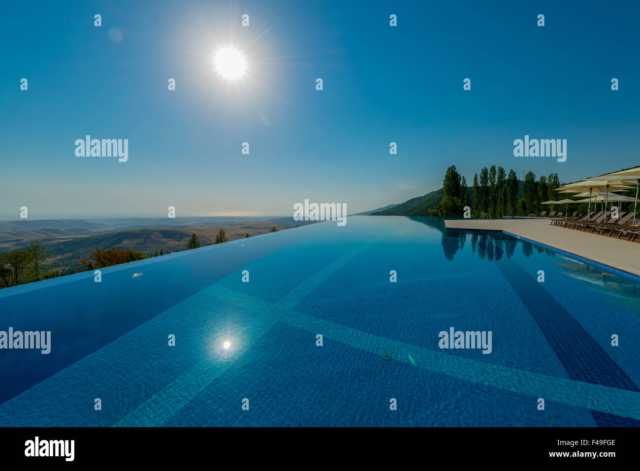 Infinity pool on the bright summer day Stock Photo - Alamy