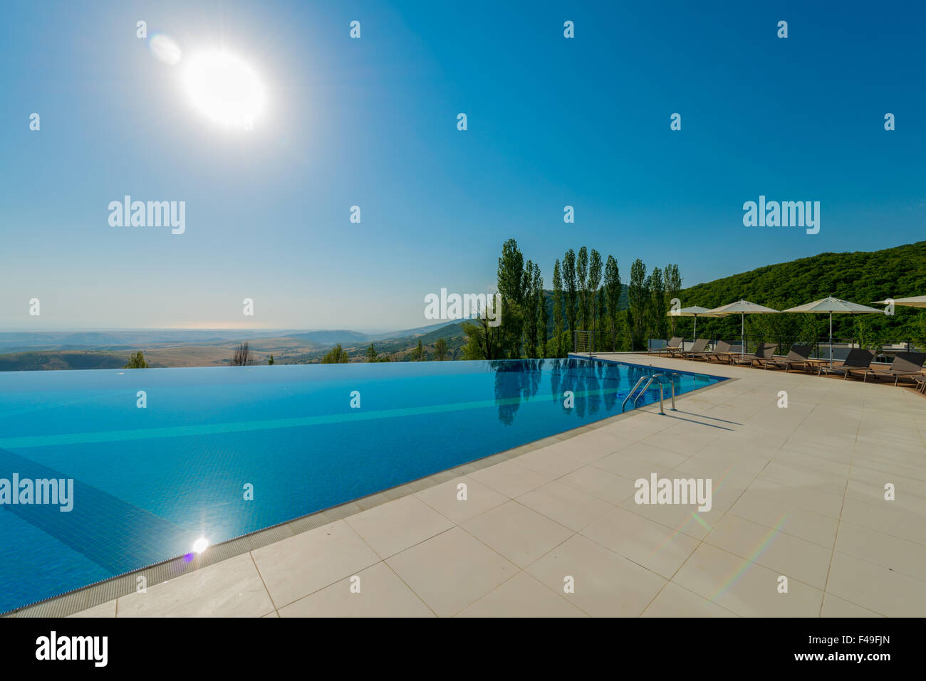 Infinity pool on the bright summer day Stock Photo - Alamy