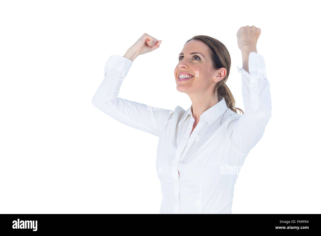 Businesswoman cheering with arms up Stock Photo - Alamy