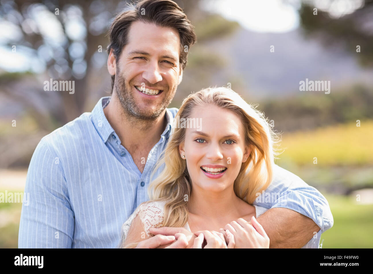 Cute couple on date looking at the camera Stock Photo - Alamy